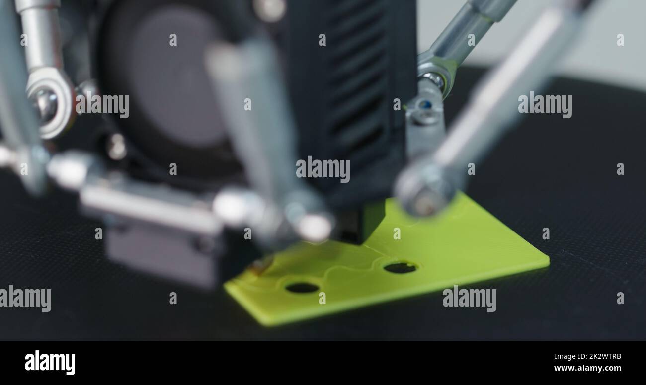 3D Printing Machine printing a piece of plastic Stock Photo - Alamy