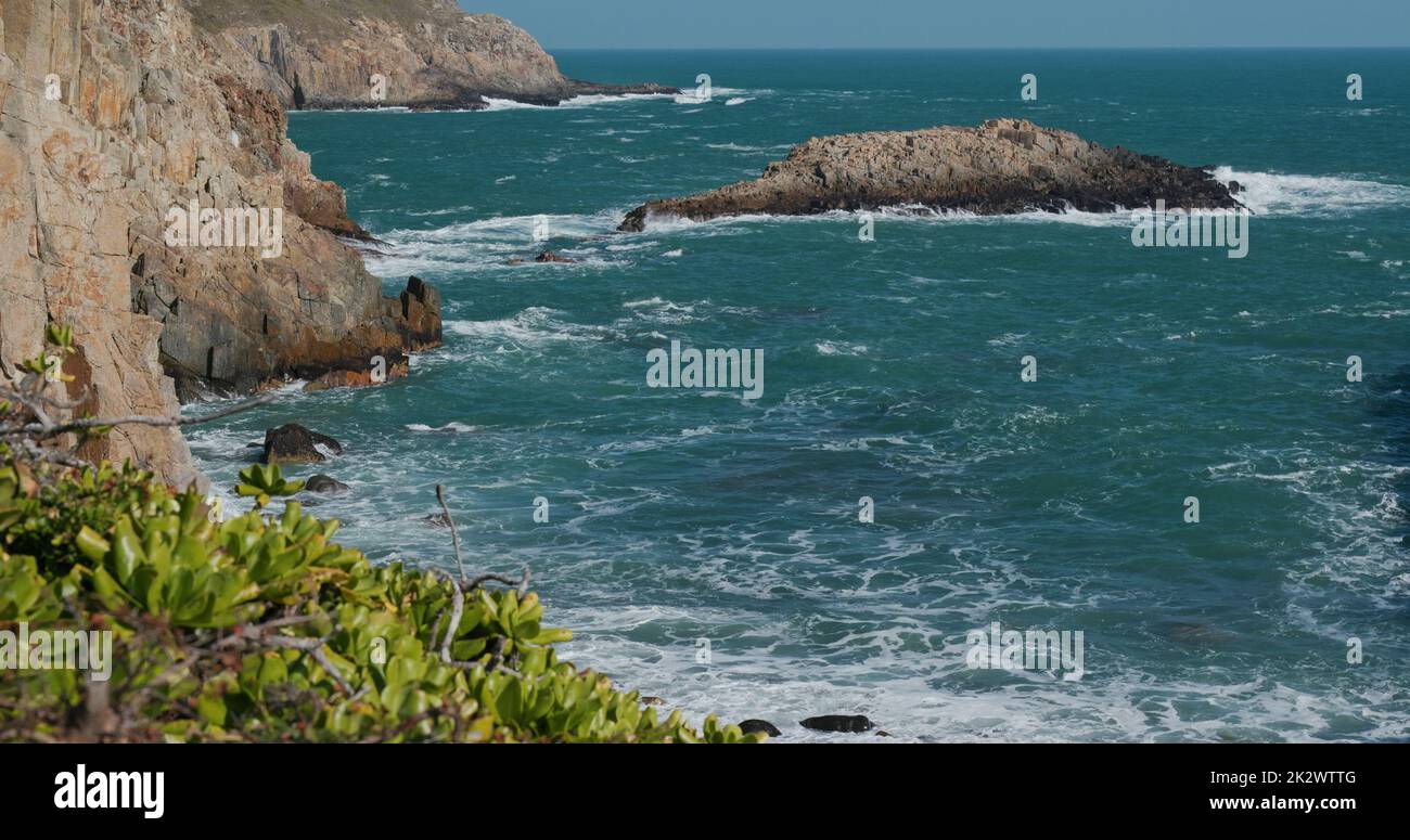 Ocean waves splash against the cliff Stock Photo - Alamy