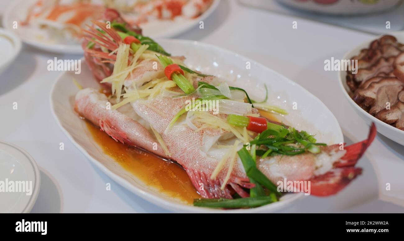 Chinese style cuisine steamed fish Stock Photo - Alamy