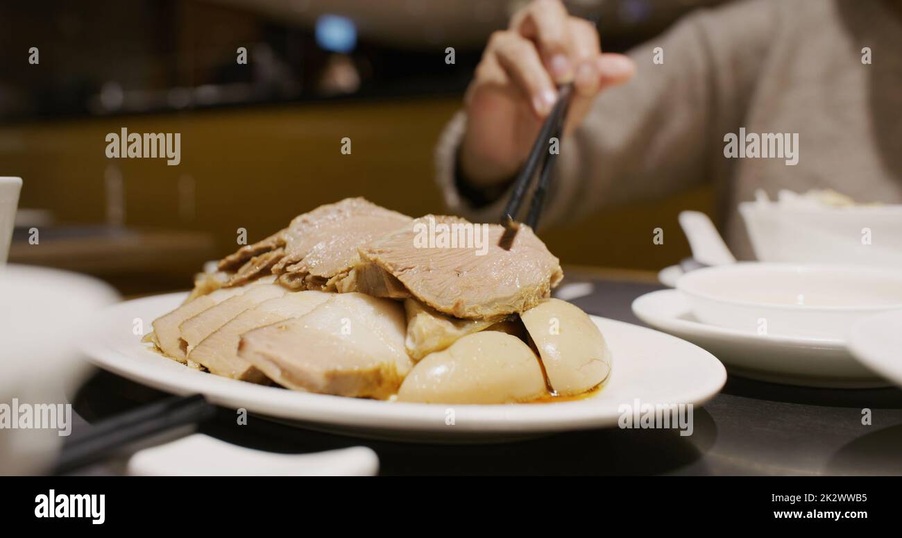 Woman having Chaozhou style cuisine Stock Photo - Alamy