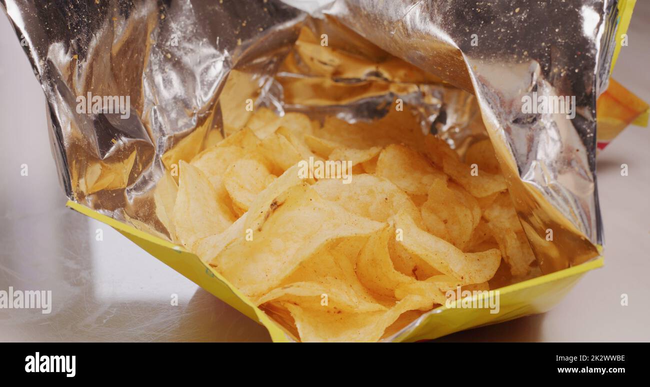Take Potato chip in package Stock Photo - Alamy