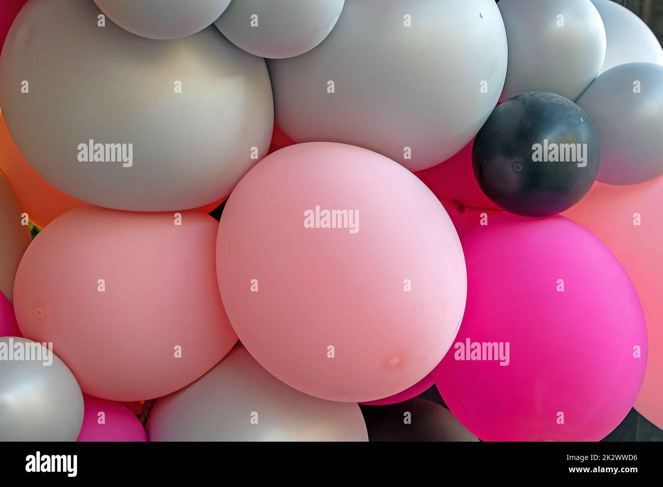 Pink balloons street celebration Stock Photo - Alamy