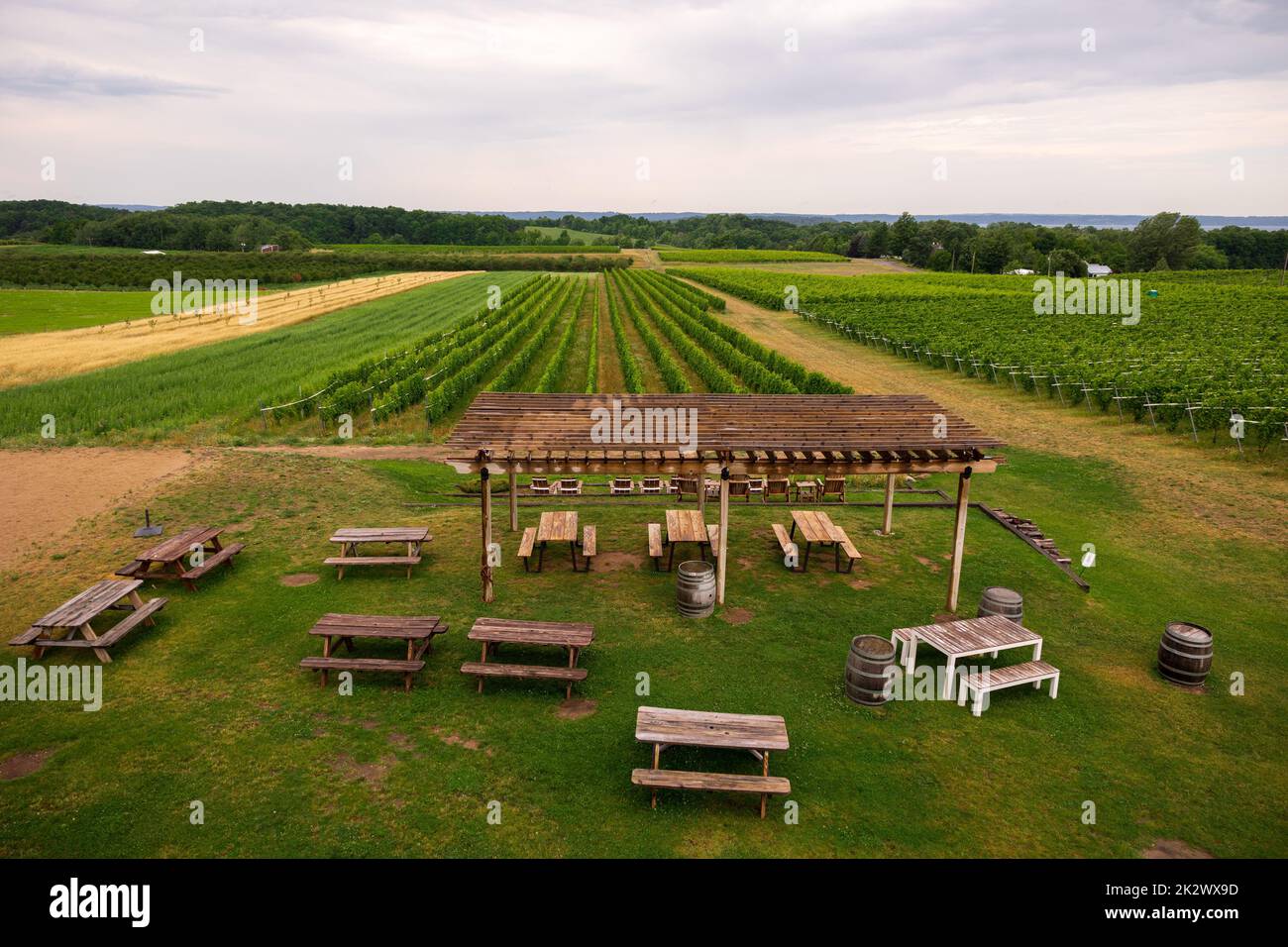 A beautiful aerial view of wooden tables and benches set up in a lovely ...