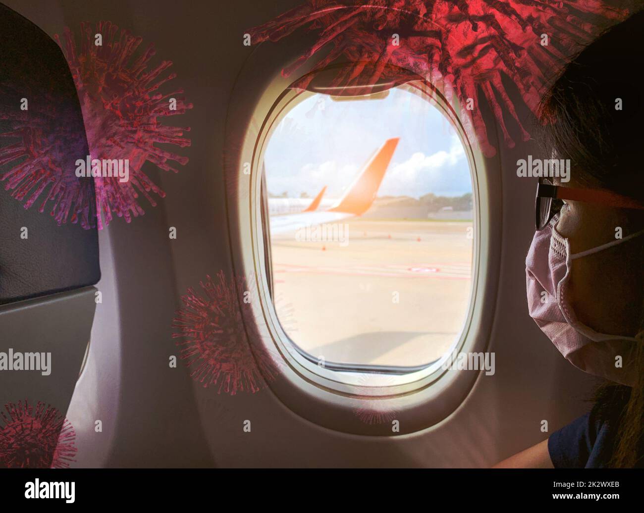 Woman wear surgical mask sit on passenger seat near cabin window of the ...
