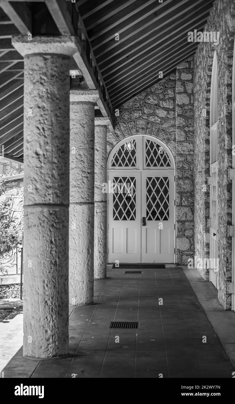 A vertical shot of the entrance of old church with beautiful columns ...