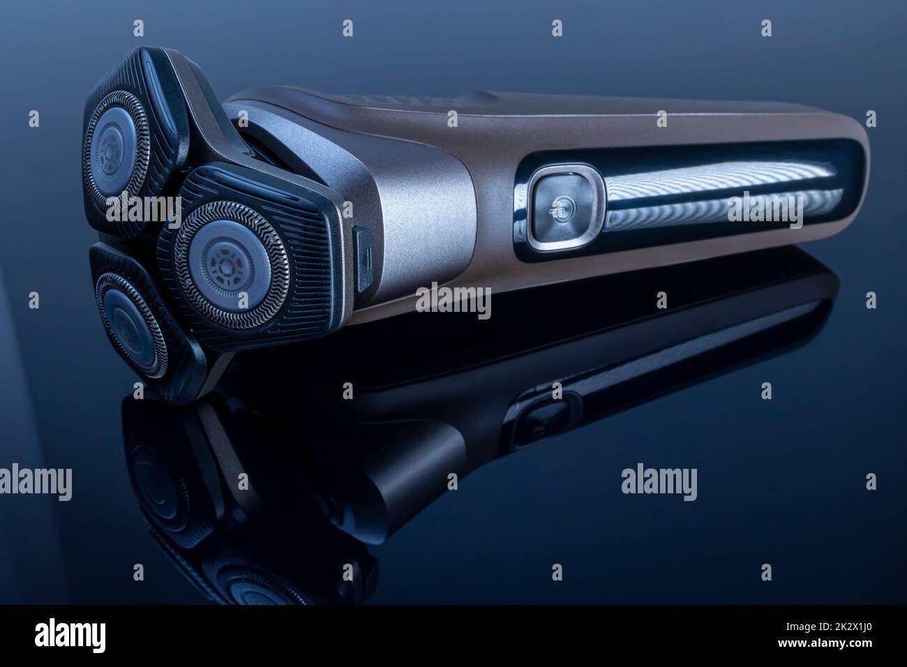 Electric shaver closeup on black background Stock Photo - Alamy