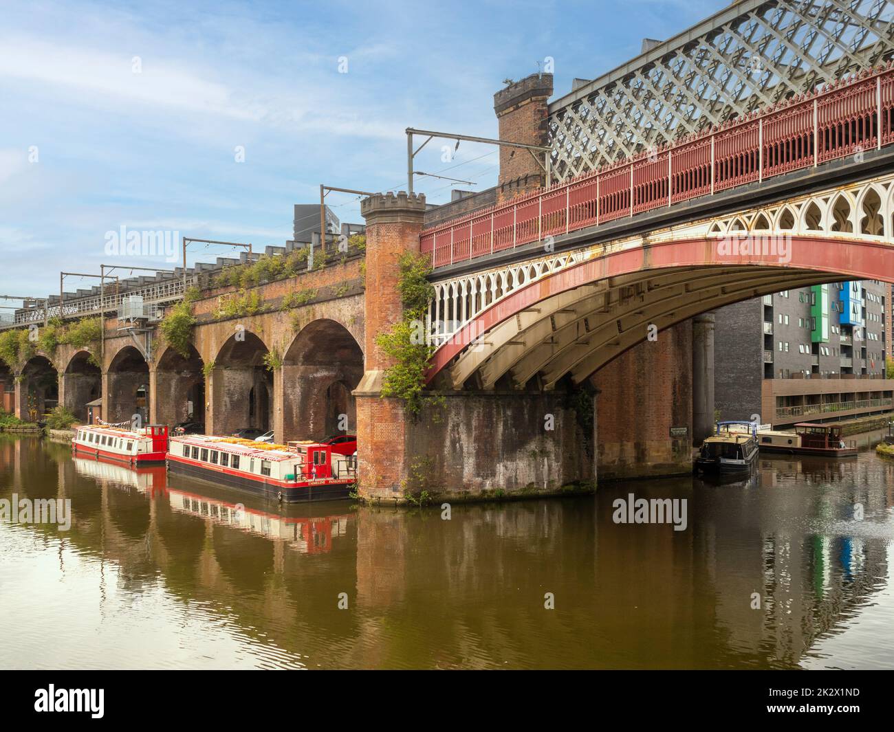 Moored barges on the Bridgewater canal, alongside the Castlefield ...