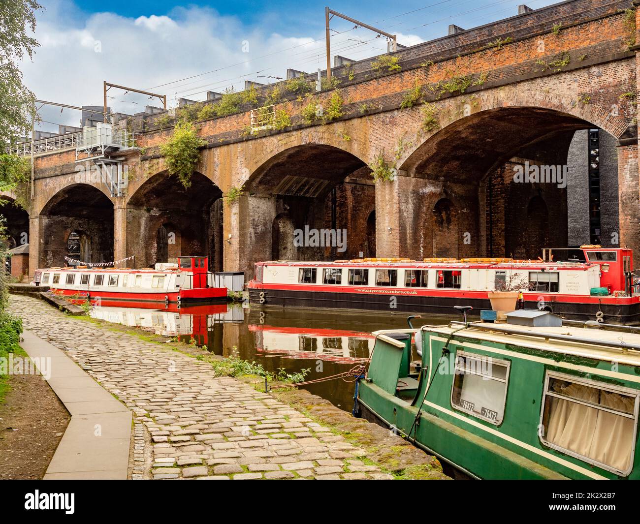 Canal cruise barges moored alongside the Bridgewater canal viaduct ...