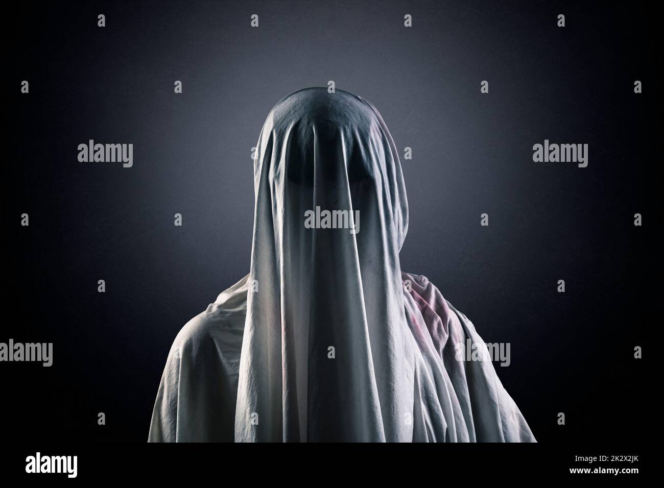 Portrait of a scary ghost over dark misty background Stock Photo - Alamy