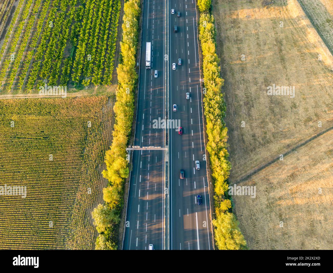 Highway from a bird's eye view. As the sun goes down, the sun's rays ...