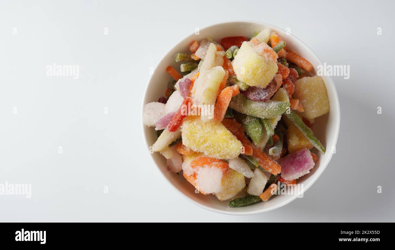 Homemade frozen various vegetables. Frozen vegetable mix on white ...