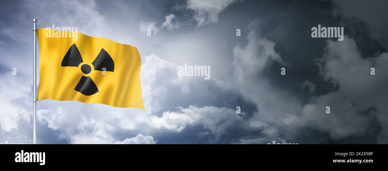 radioactive nuclear symbol flag on a cloudy sky Stock Photo - Alamy