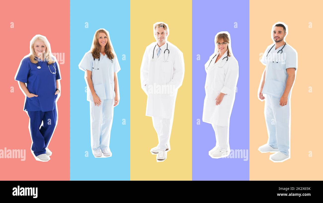 Full length portrait of confident medical team standing in row against ...