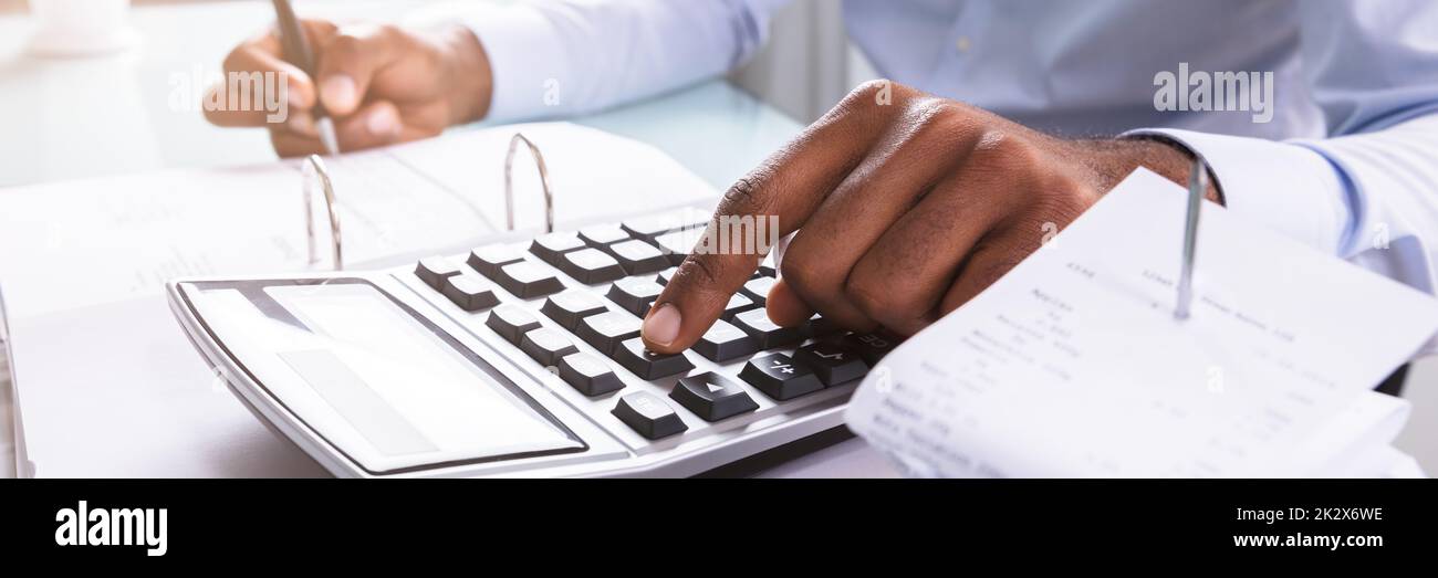 Businessman Calculating Invoice Stock Photo - Alamy Businessman Calculating Invoice Stock Photo - Alamy