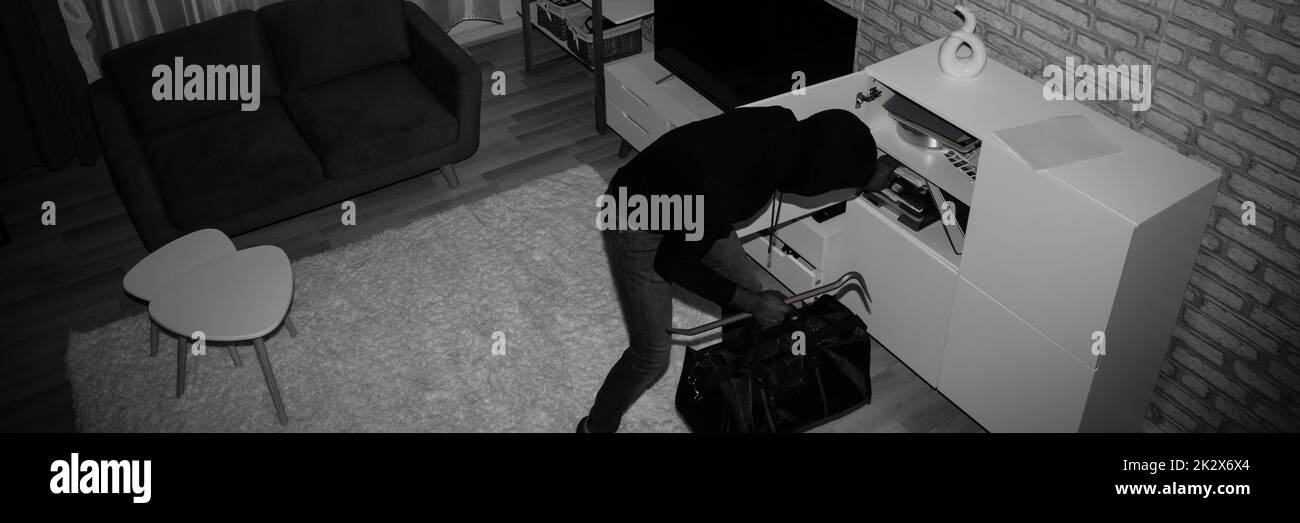 Thief Stealing In The House Stock Photo - Alamy