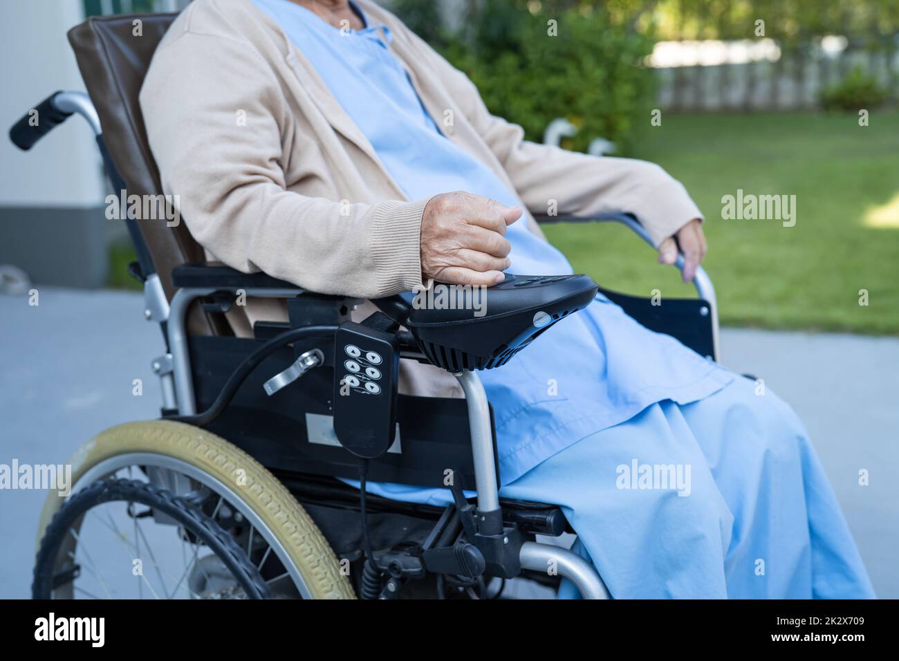 Asian senior or elderly old lady woman patient on electric wheelchair ...