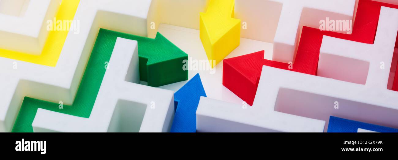 Multi Colored Arrows In The Centre Of Maze Stock Photo - Alamy