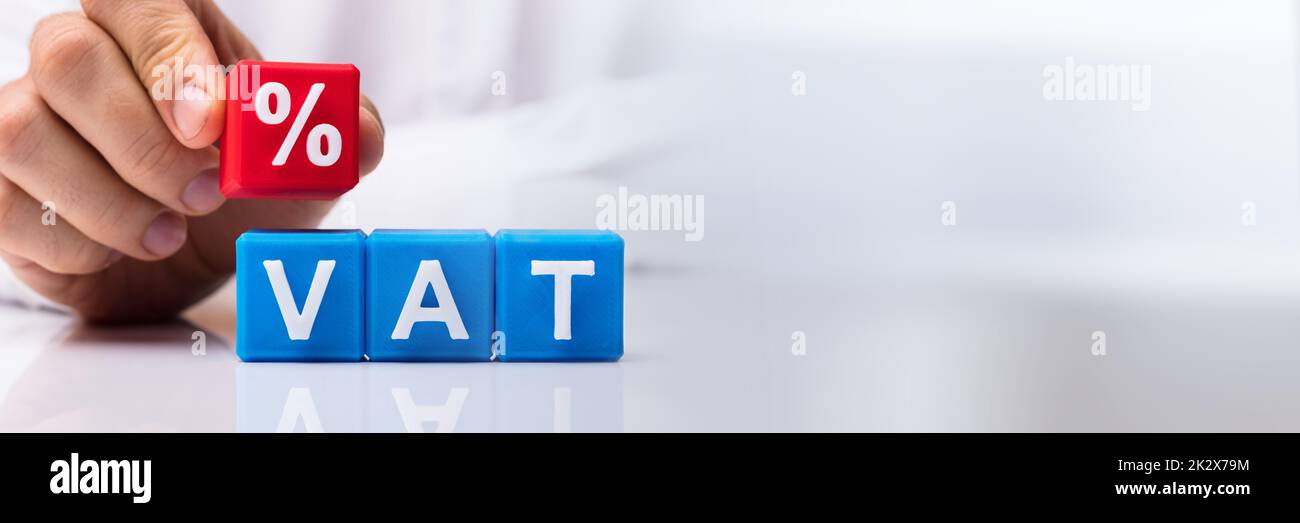 Person Placing Red Percentage Block Over Vat Stock Photo - Alamy