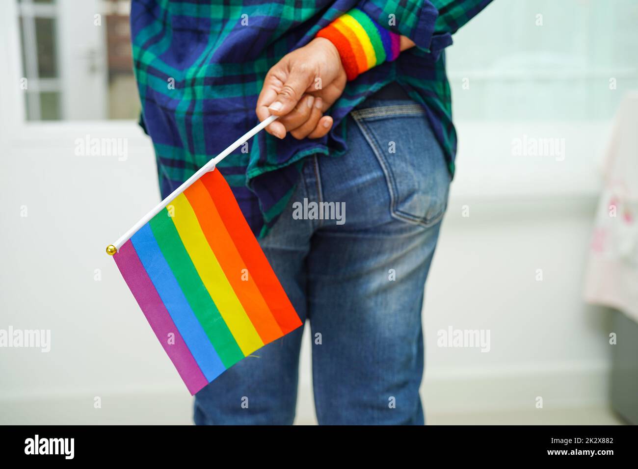 Asian woman with rainbow flag, LGBT symbol rights and gender equality ...