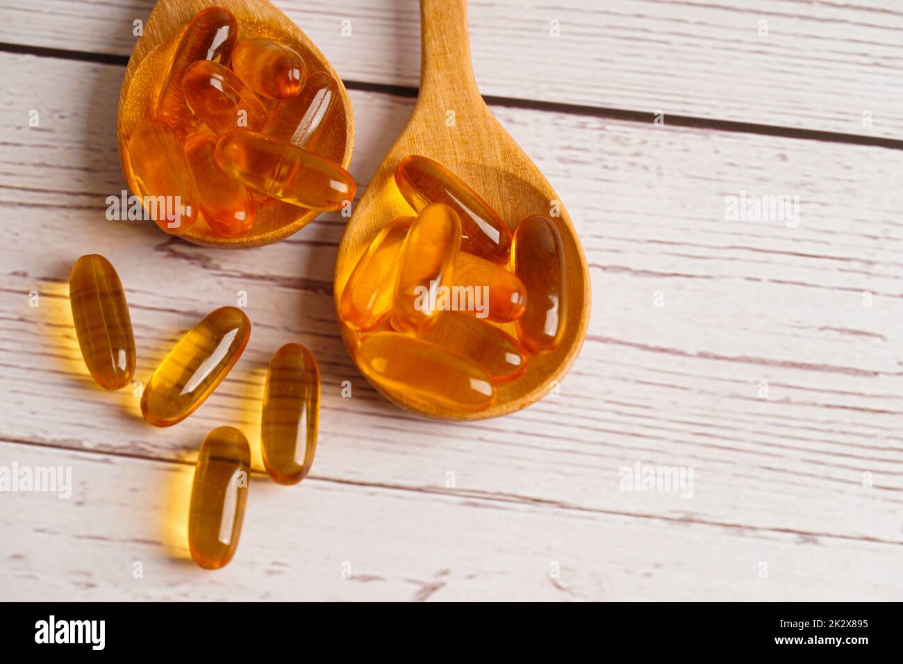 Fish oil or Cod liver oil gel in capsules with omega 3 vitamins ...