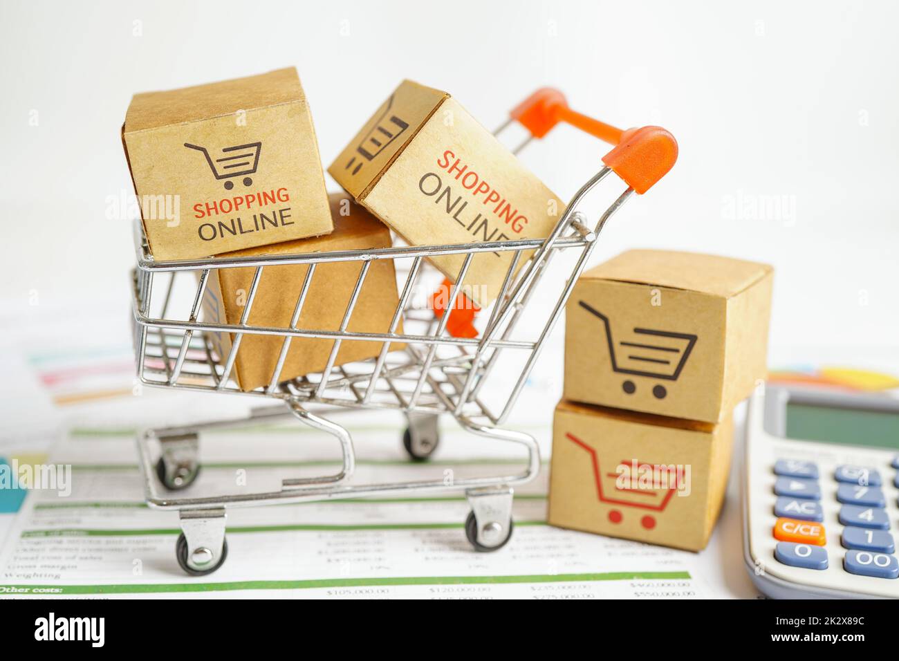 Online shopping, Shopping cart box on calculator, import export ...