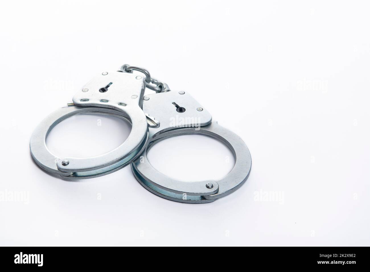 Metal handcuffs on a white isolated background, copy space Stock Photo ...