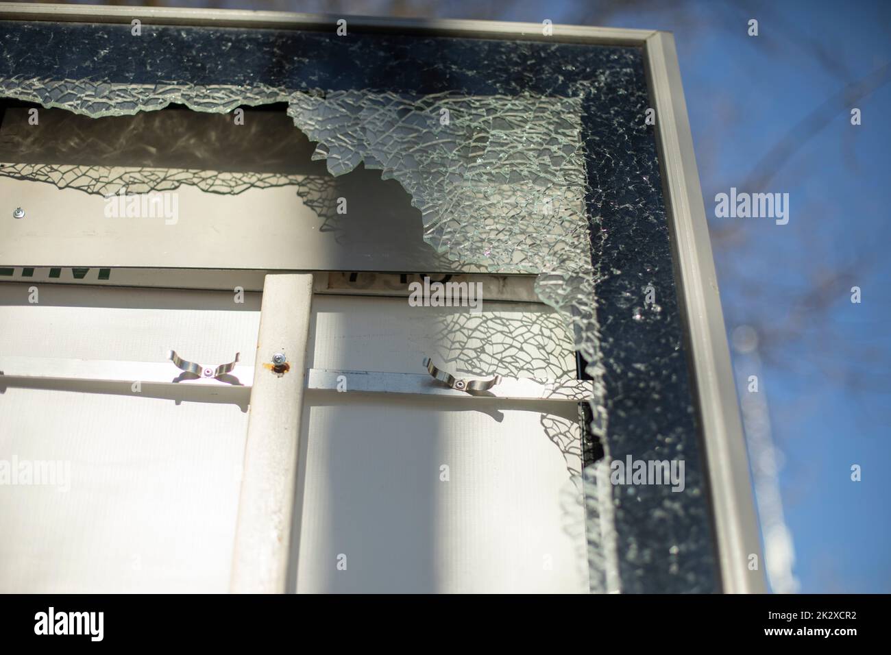 Broken glass of advertising construction. Shards of glass in billboard ...