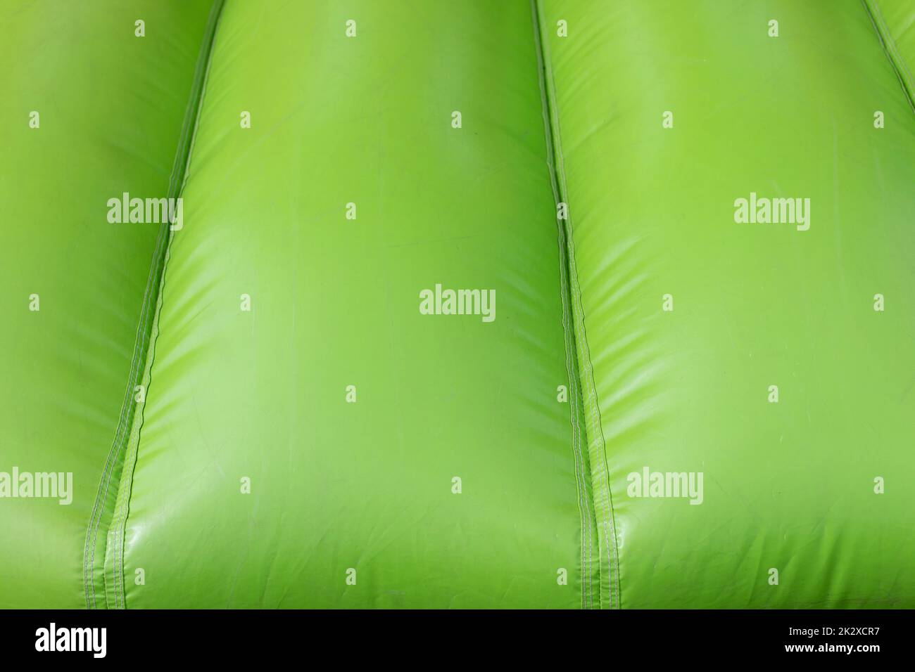 Inflatable design. Trampoline for jumping. Green material. Air three ...