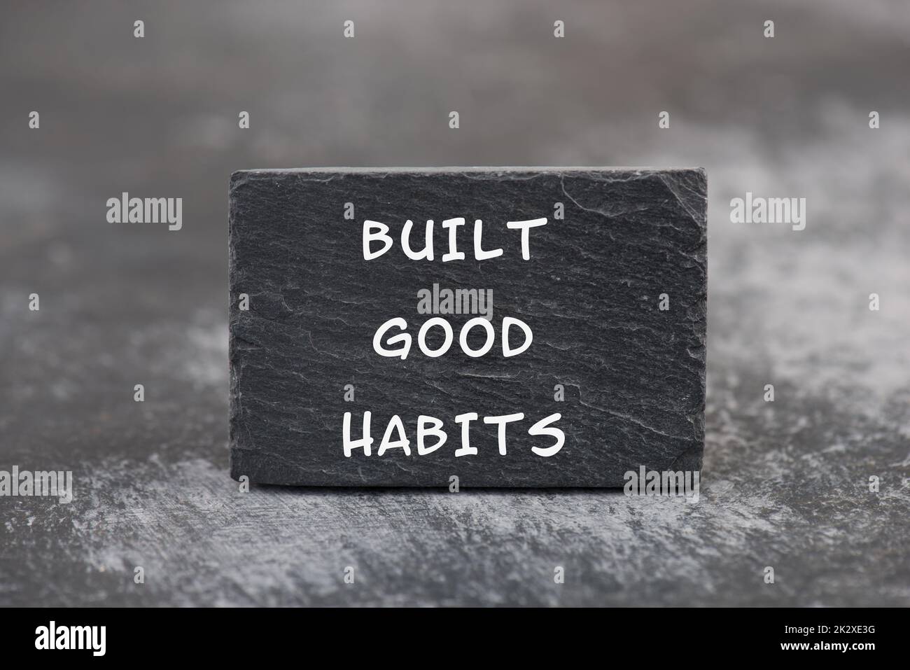 The words build good habits are standing on a blackboard, change ...