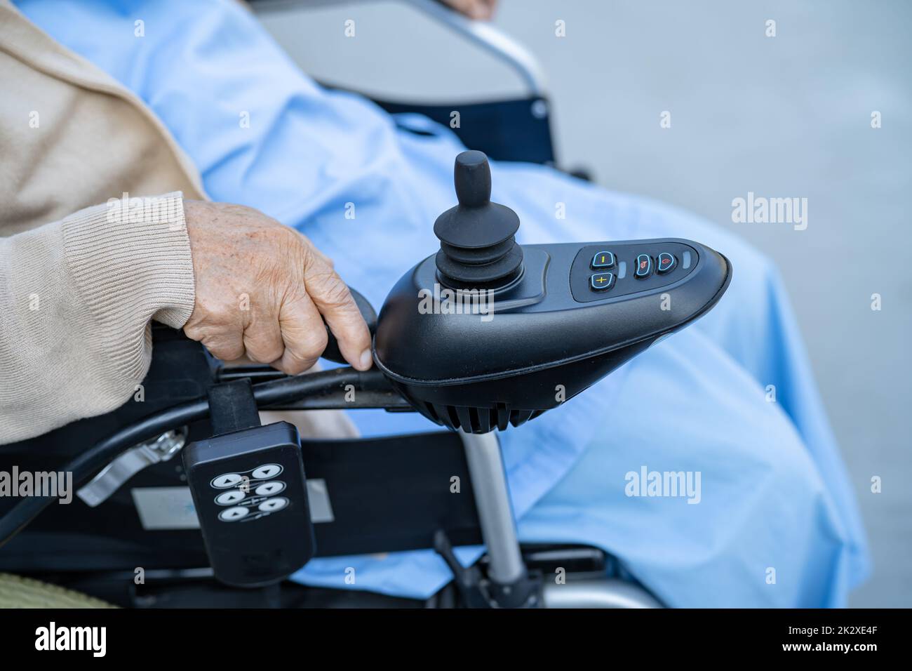 Asian senior or elderly old lady woman patient on electric wheelchair ...