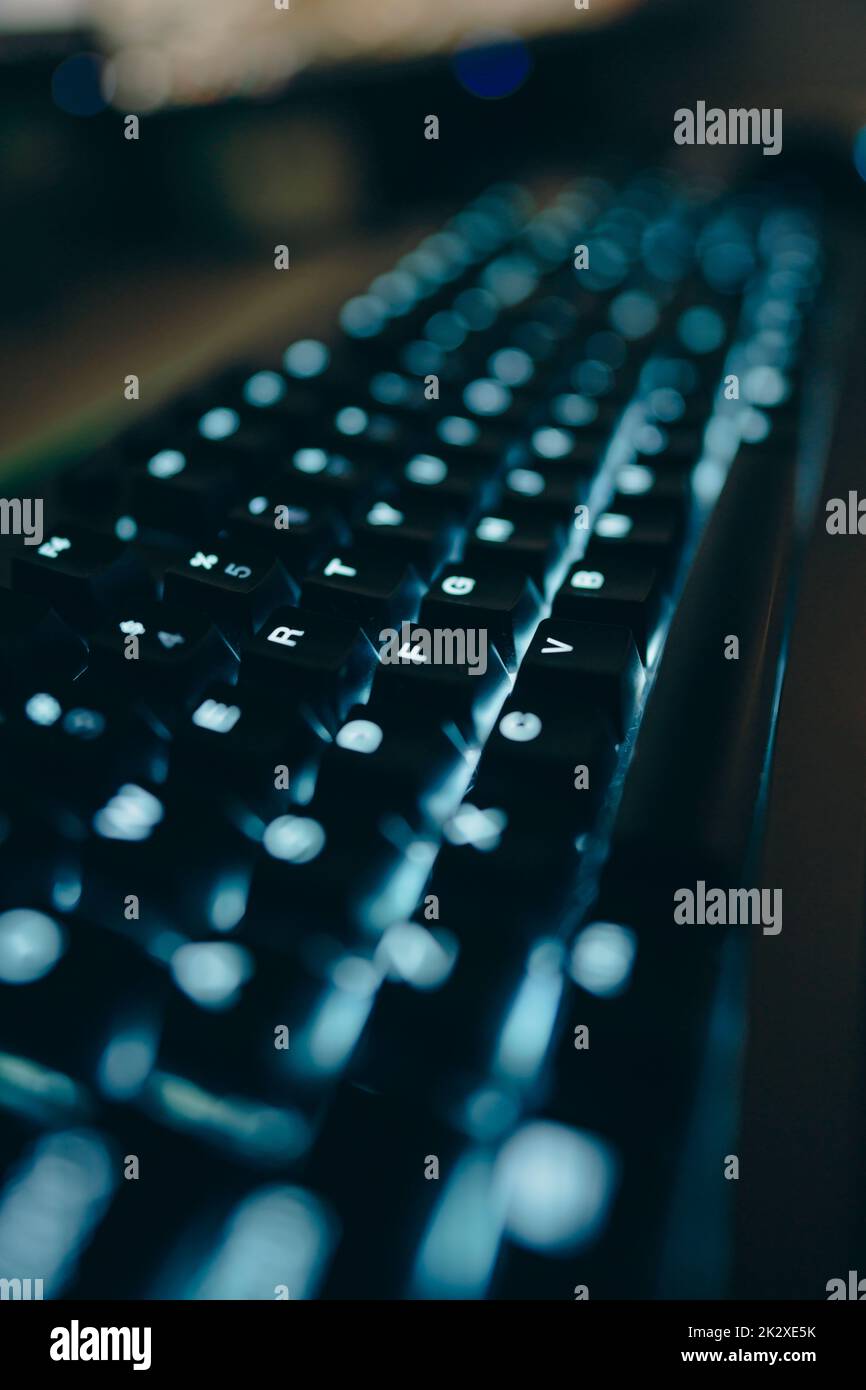 Keyboard in low light Stock Photo - Alamy