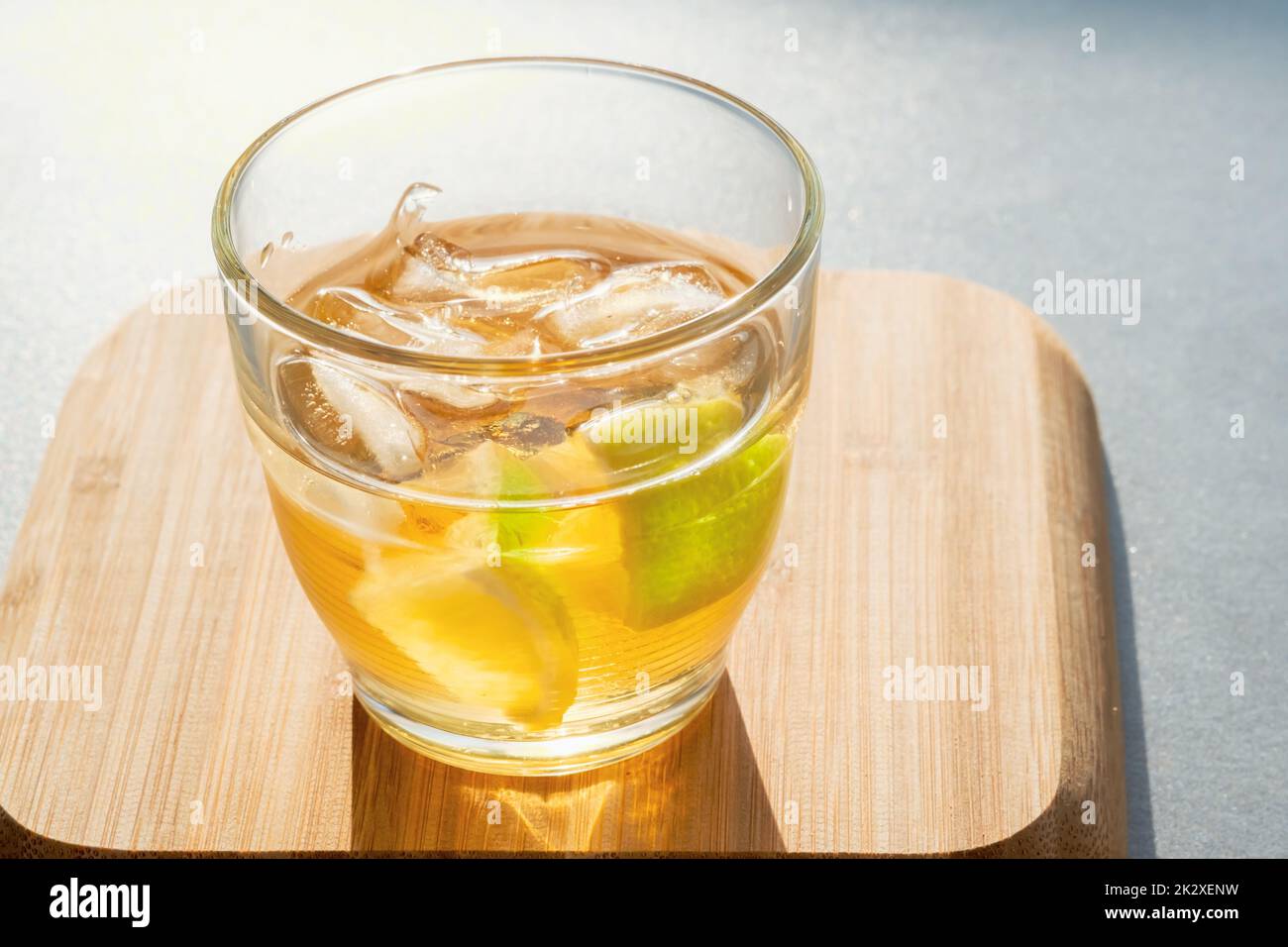 Golden rum on the rocks Stock Photo - Alamy