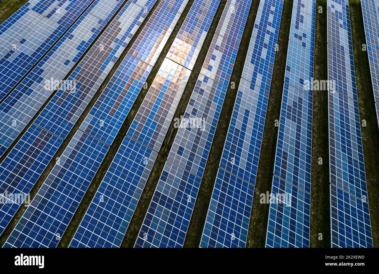 solar panel field at work with sun reflection Stock Photo - Alamy