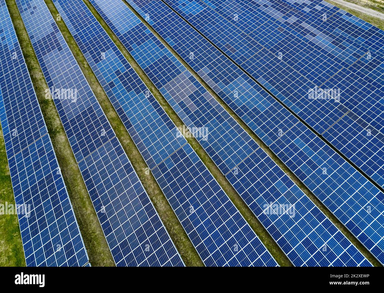 solar panel field at work with sun reflection Stock Photo - Alamy