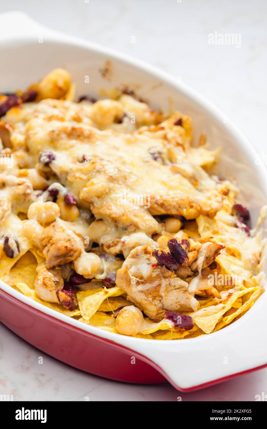 nachos with chicken meat, red beans and cheese Stock Photo - Alamy