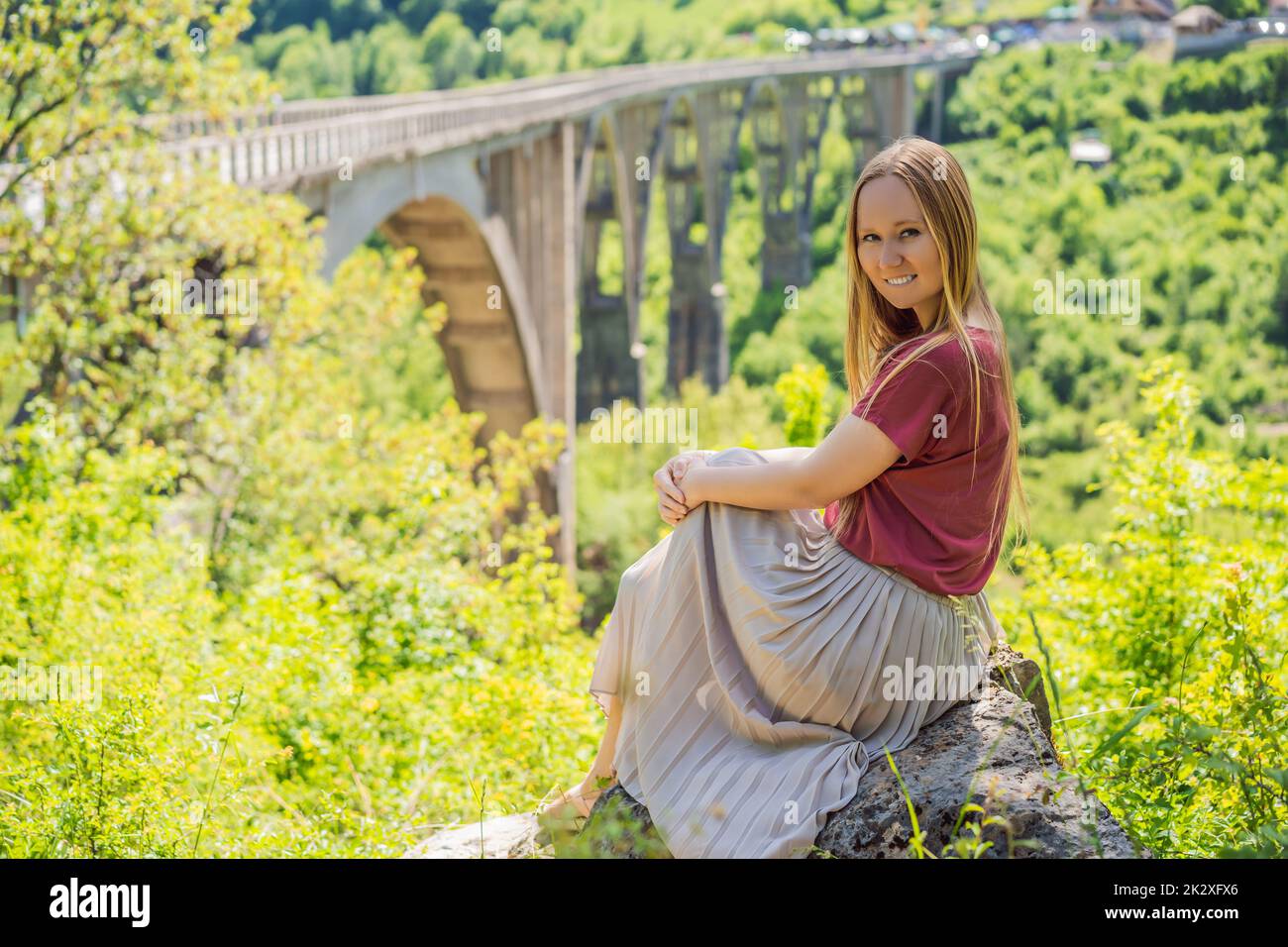 Montenegro. Woman tourist in background of Dzhurdzhevich Bridge Over ...