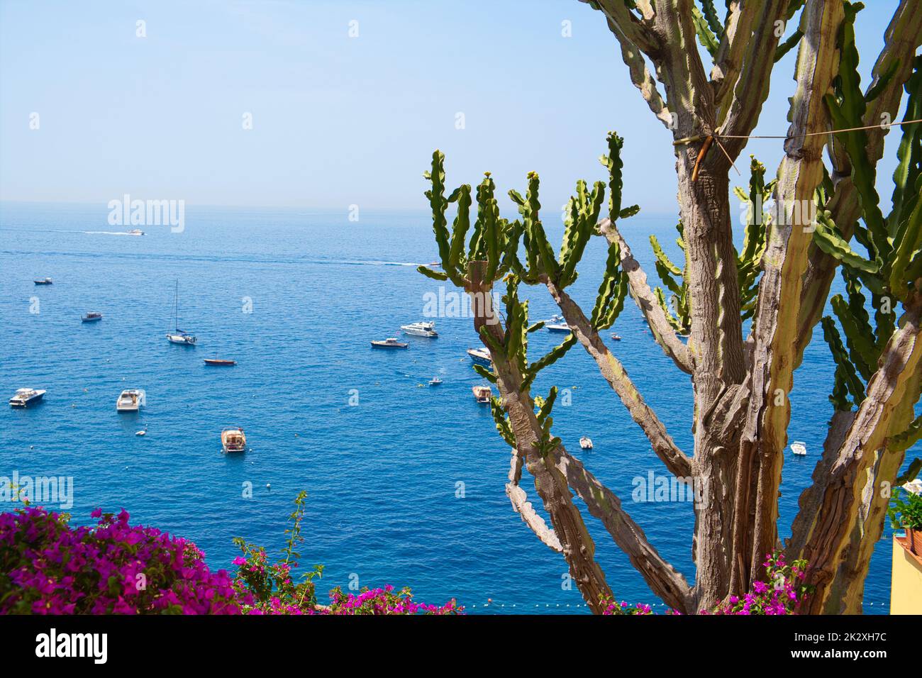 An aerial view of boats on the blue sunny sea of Positano, Italy Stock ...