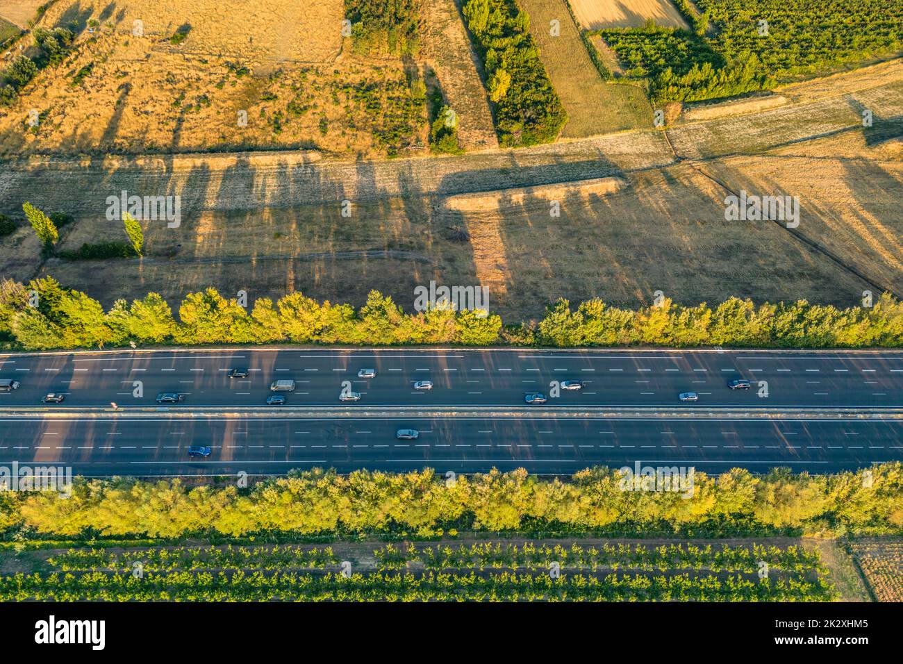 Highway from a bird's eye view. As the sun goes down, the sun's rays ...