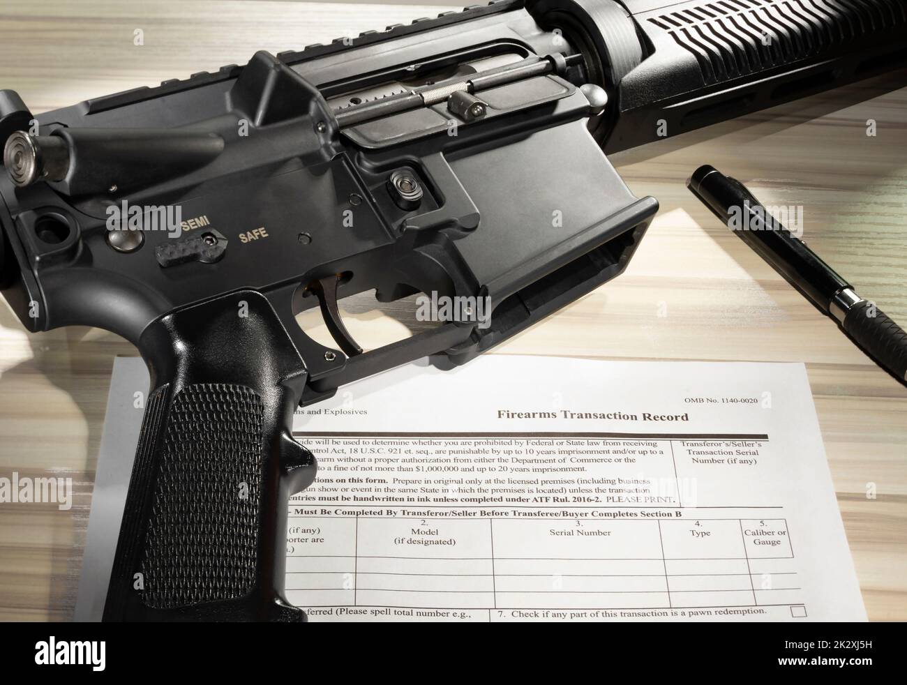 AR-15 and background check form for its purchase with pen Stock Photo ...