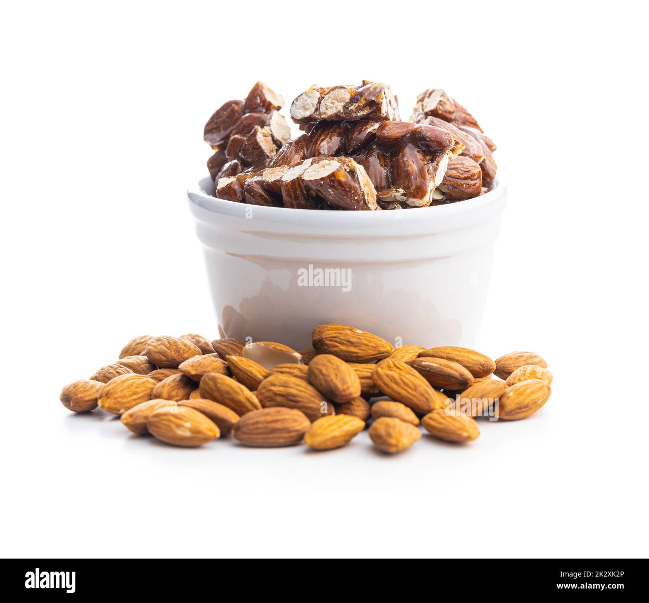 Almond nuts and sweet mini almond bars isolated on white background ...