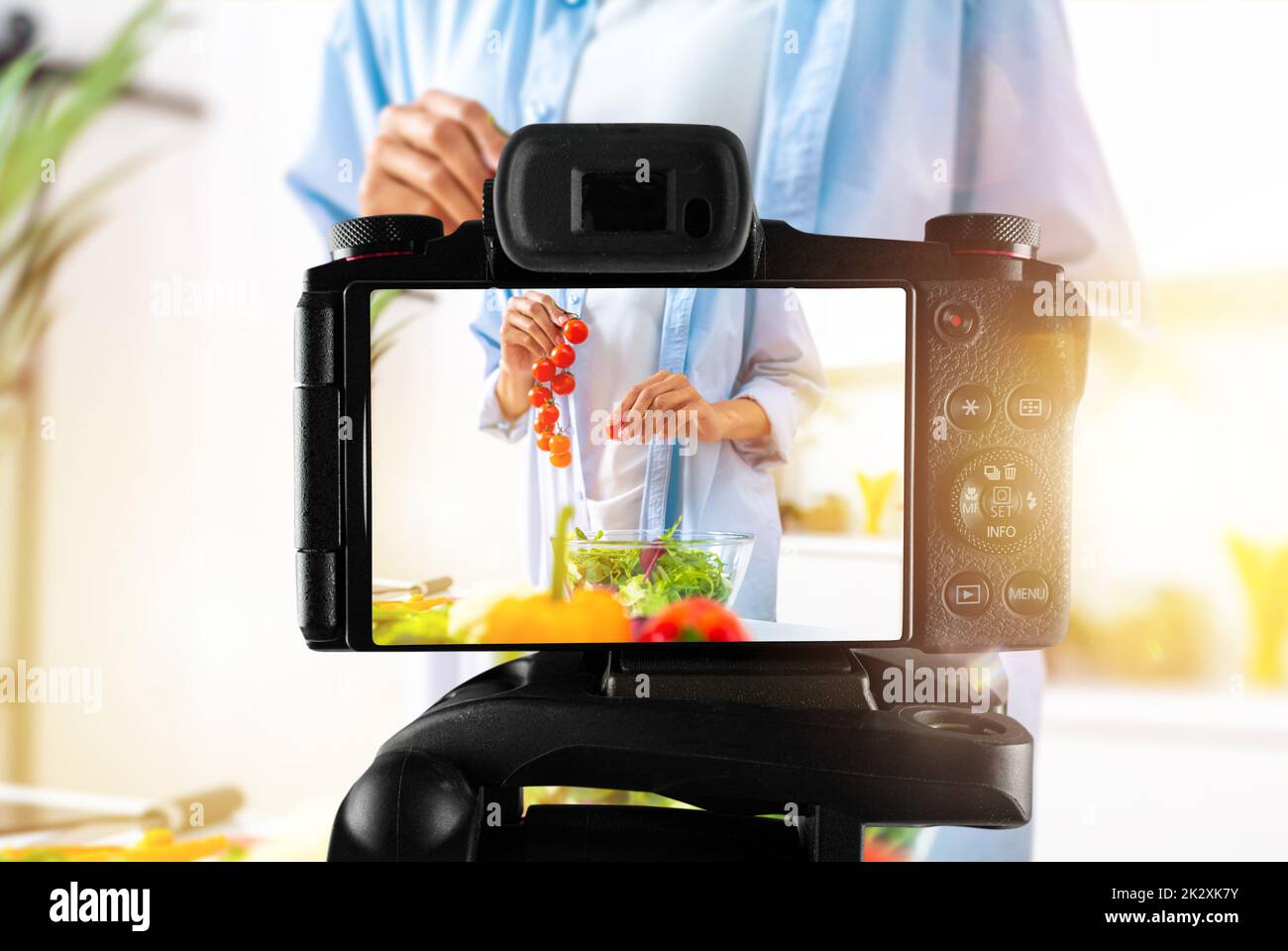 Vlogger woman chef records a video of cooking recipe Stock Photo - Alamy