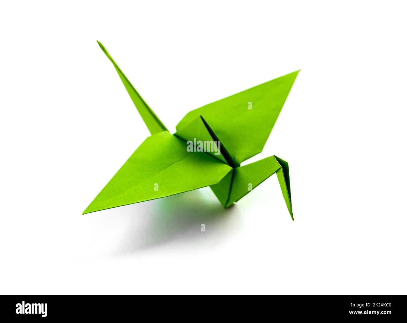 Green Paper Crane Origami Isolated On A White Background Stock Photo green-paper-crane-origami-isolated-on-a-white-background-stock-photo
