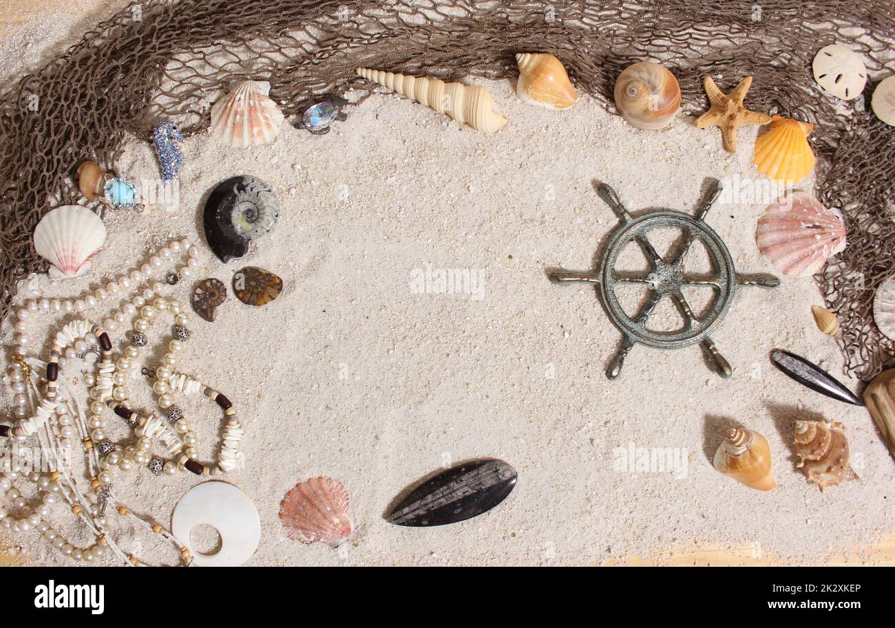 Captains Wheel With Fishing Net and Sea Shells on Sand Nautical Theme ...