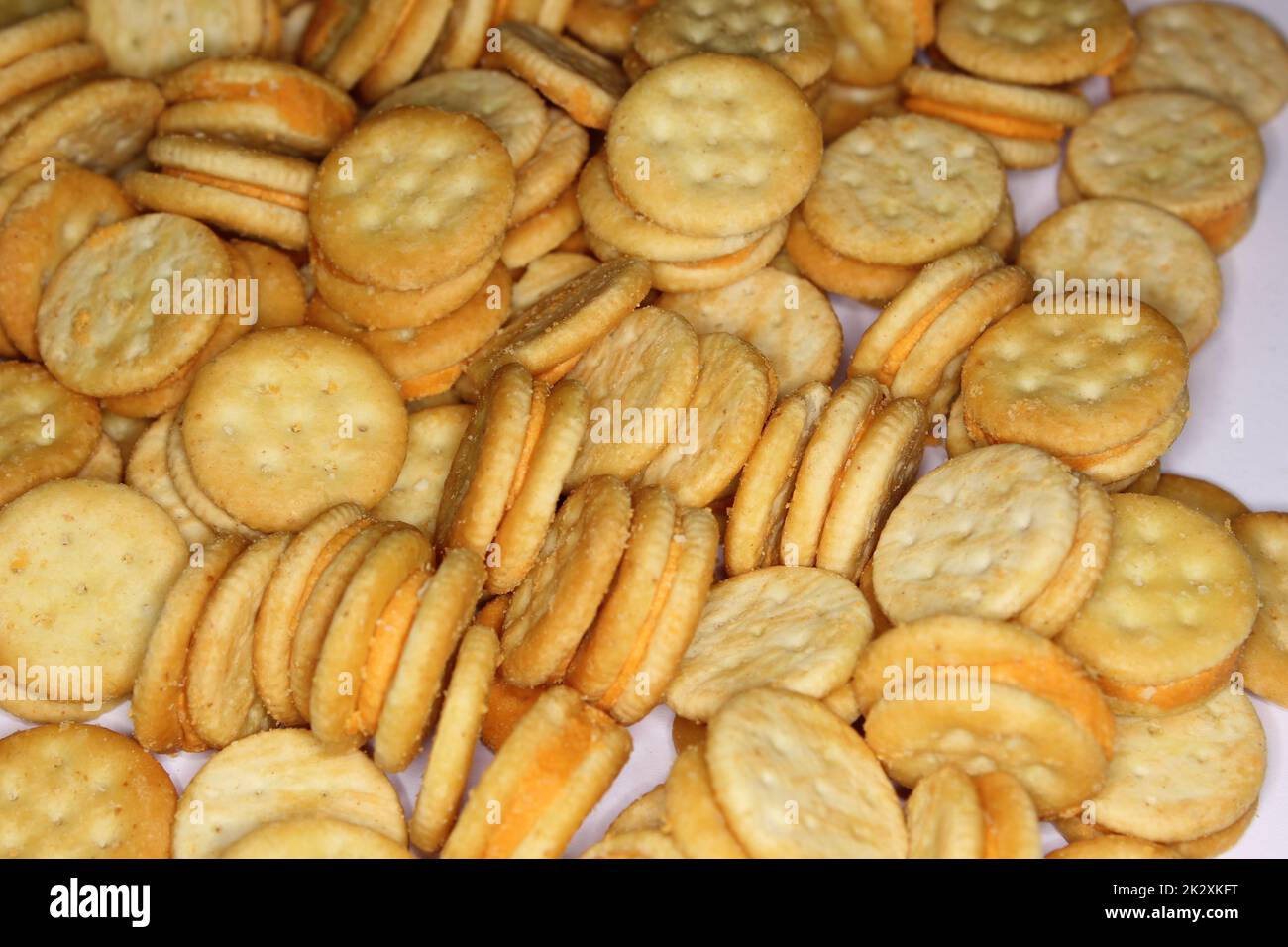 Pile of Cheese Snack Crackers Close up Stock Photo - Alamy