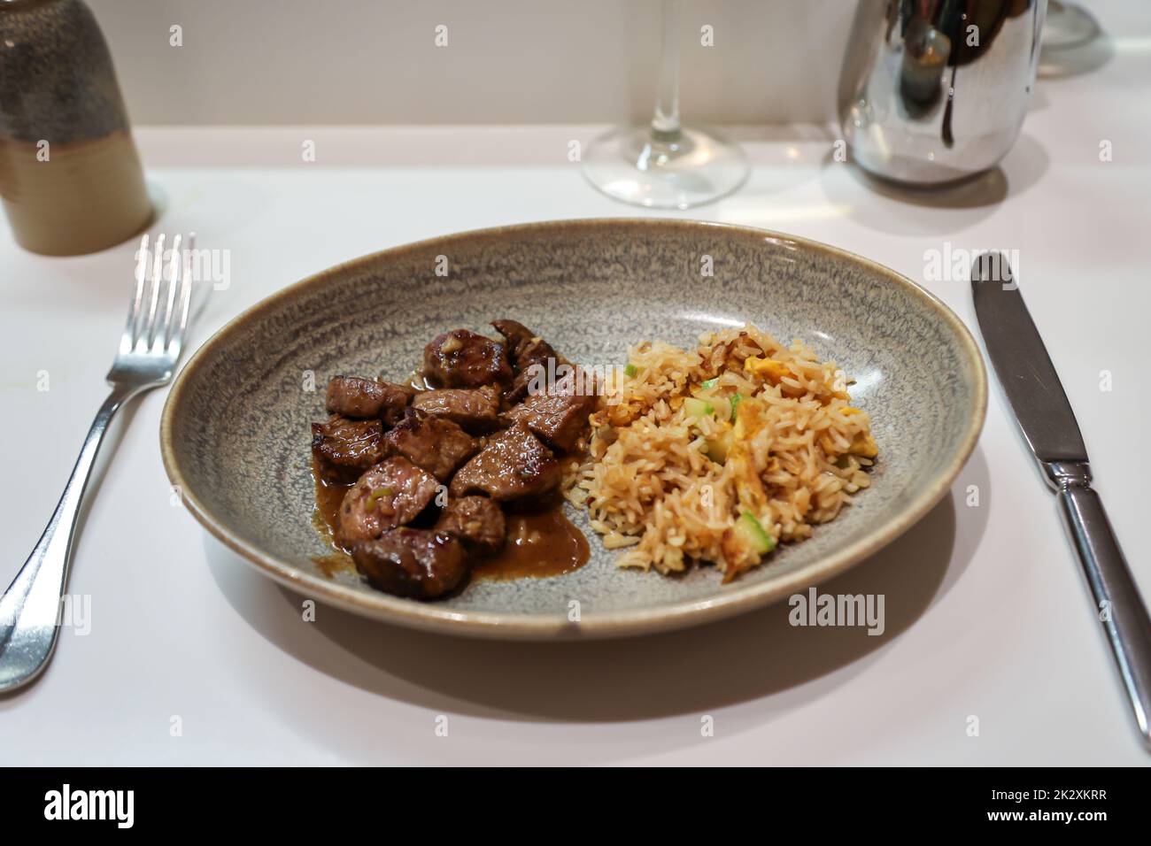 Diced beef with noodles and vegetables on a plate Stock Photo - Alamy