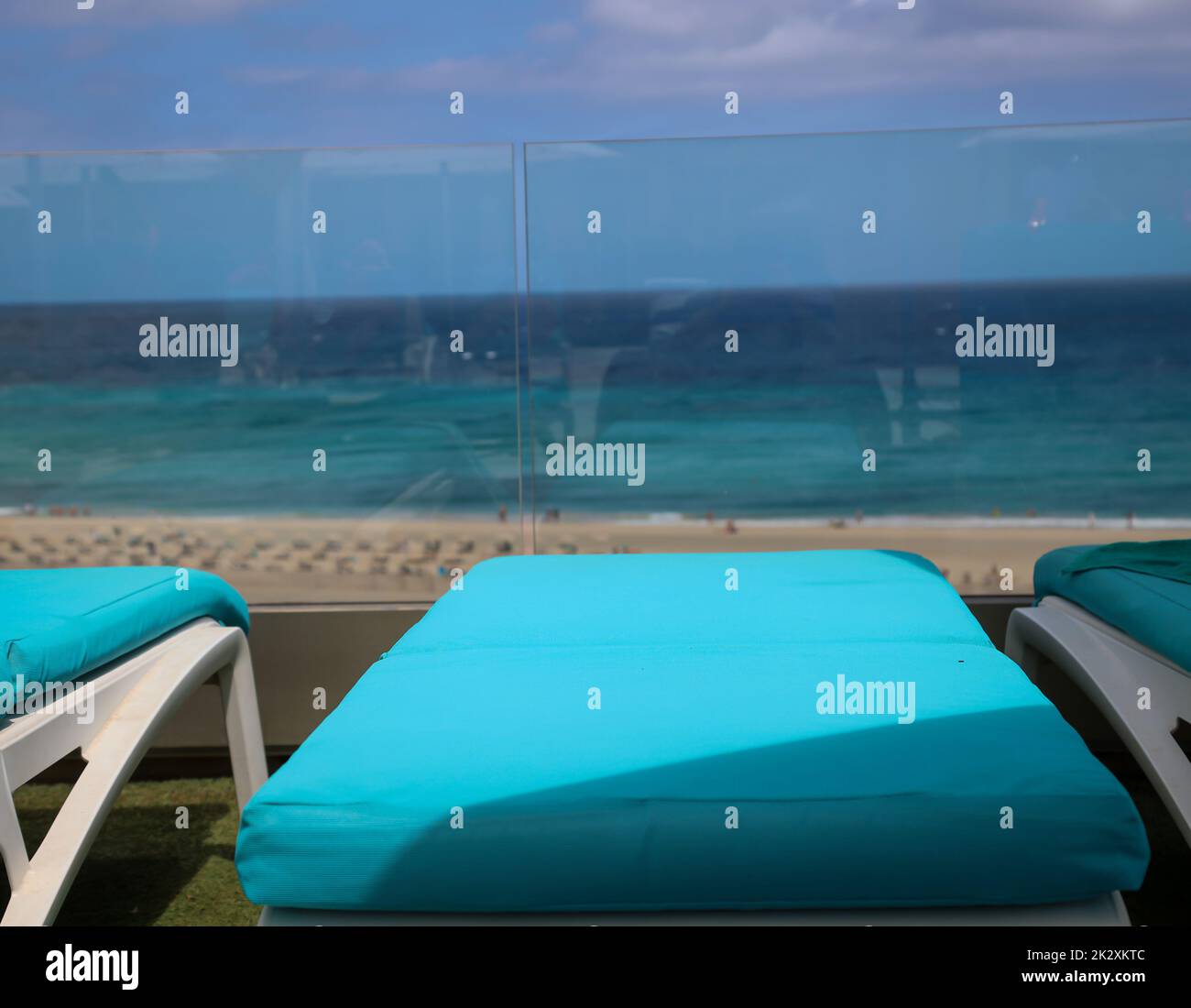 A beach lounger or pool lounger with blue lounger mat Stock Photo - Alamy