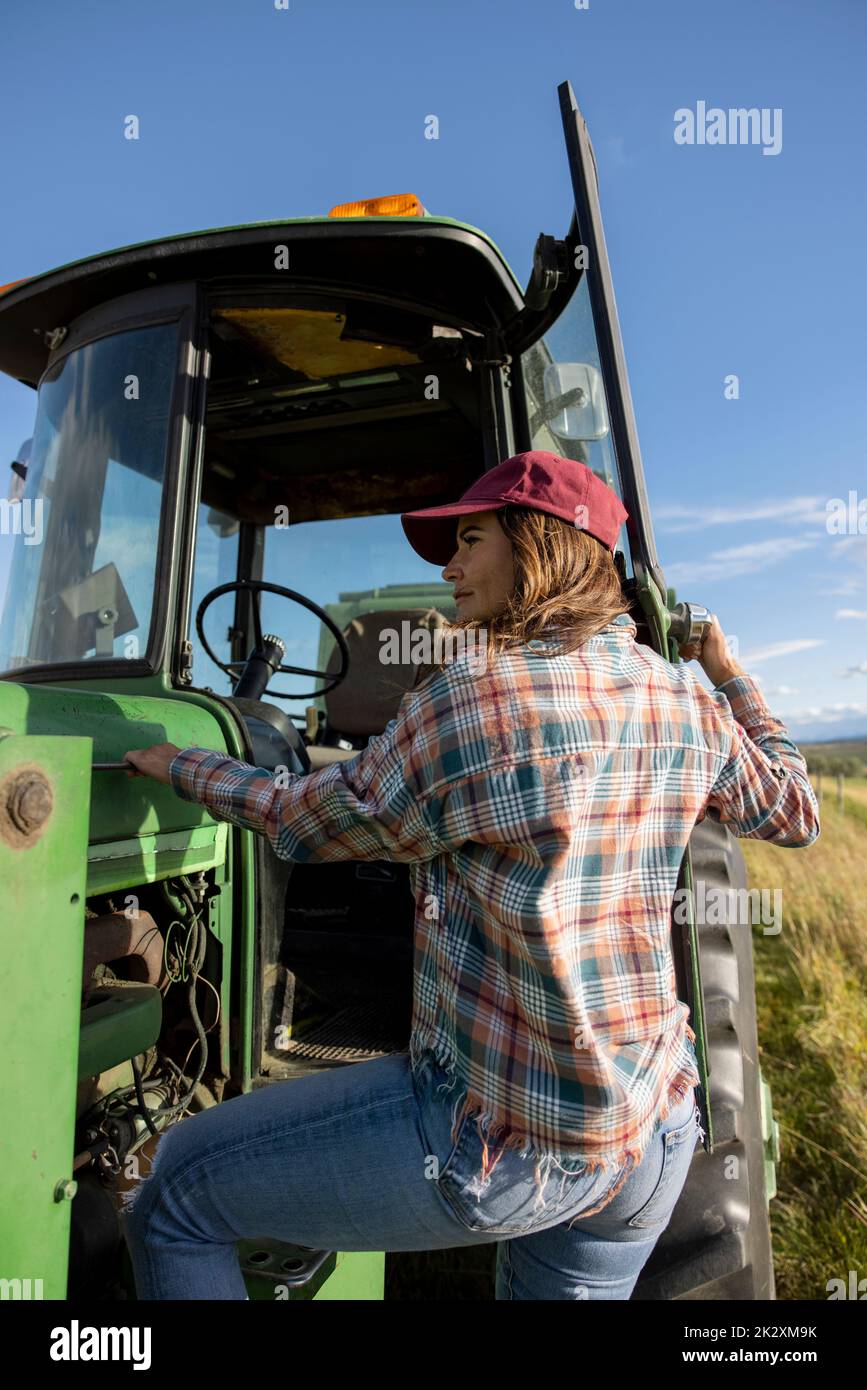Farmer standing on tractor in hi-res stock photography and images - Alamy