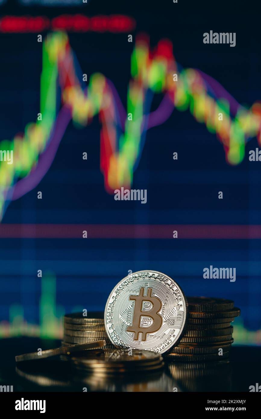 Gold Bitcoins with candle stick graph chart and digital background ...