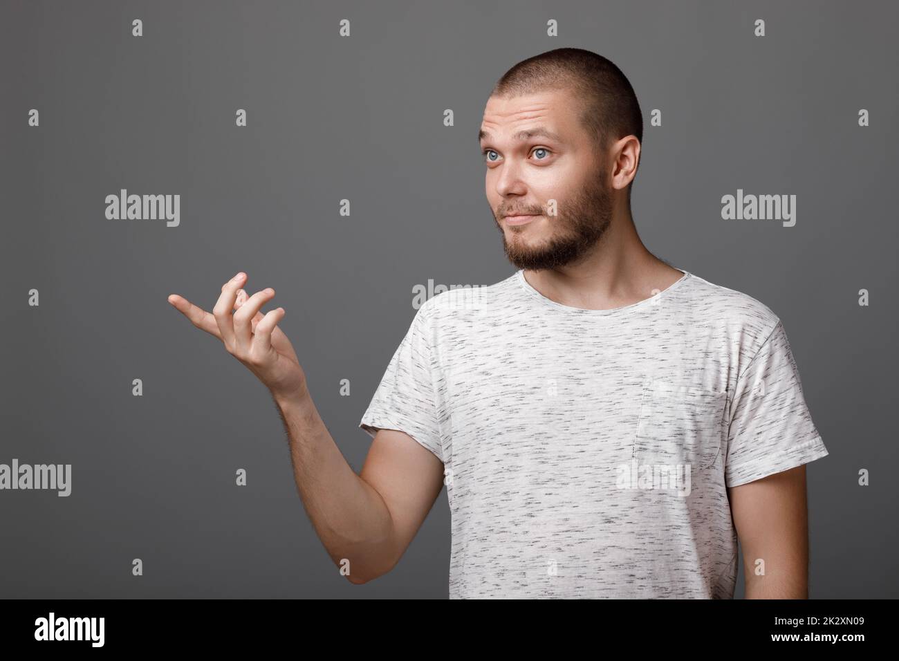 Young bearded caucasian man pointing hi-res stock photography and ...