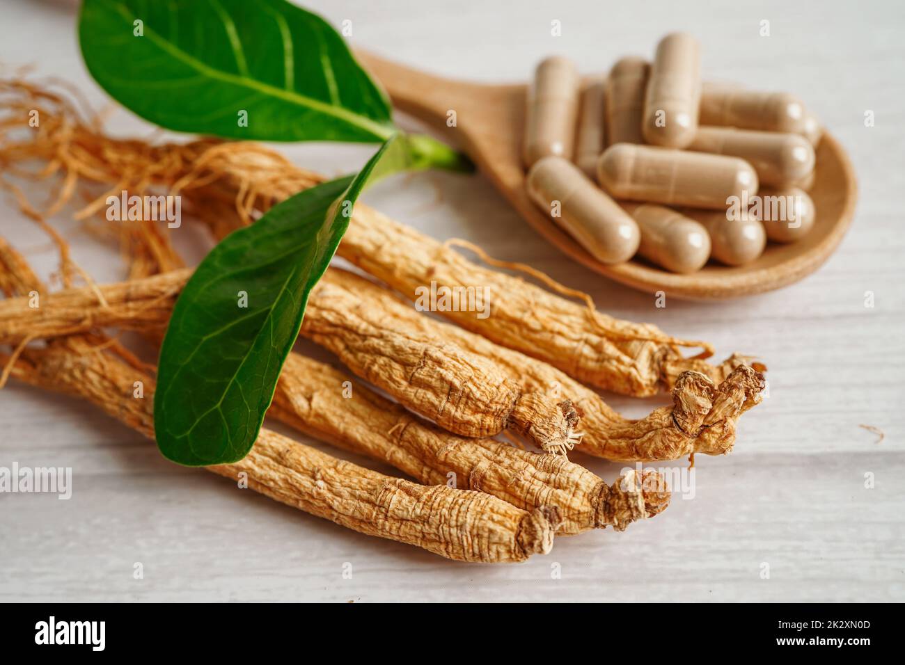 Ginseng roots and green leaf, healthy food Stock Photo - Alamy